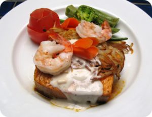 Potato Encrusted Salmon with a Shrimp Nage´ - Aggressor Adventures